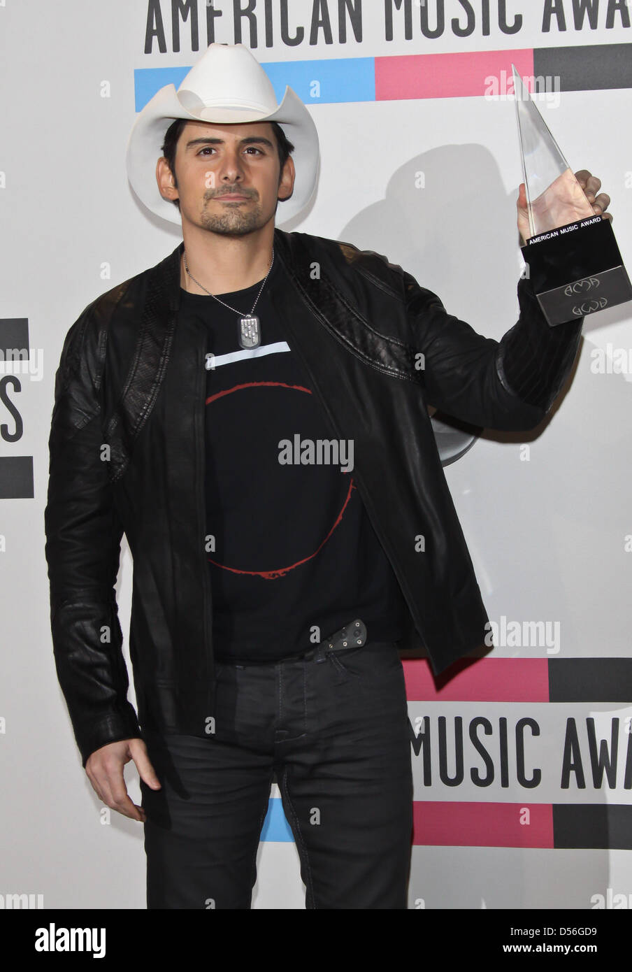 US singer Brad Paisley holds his award for Favorite Country Male Artist ...