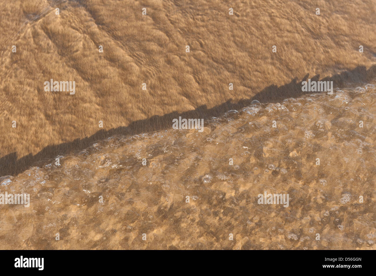 Low tide ripples reflections refraction stream wave patterns in shallow ...