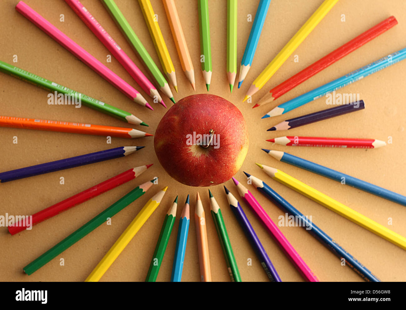 Color pencils with apple Stock Photo - Alamy