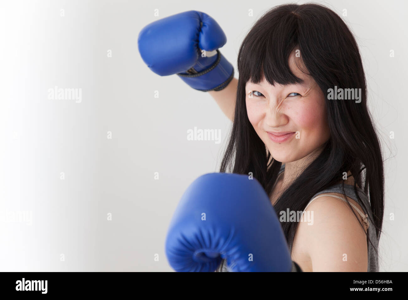 Chinese boxer with raised fists Stock Photo - Alamy