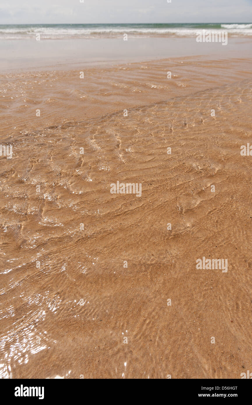 Low tide ripples reflections refraction stream wave patterns in shallow ...