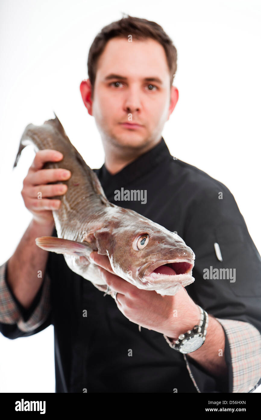 Black man cooking fish hi-res stock photography and images - Alamy