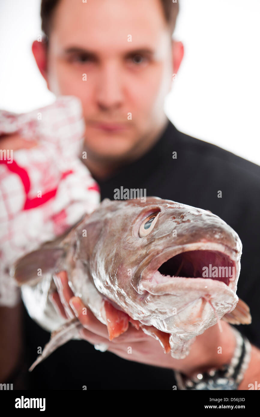 Black man cooking fish hi-res stock photography and images - Alamy