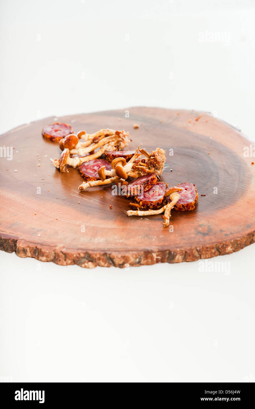 Raw ingredients on a wooden cutting plate on white table Stock Photo ...