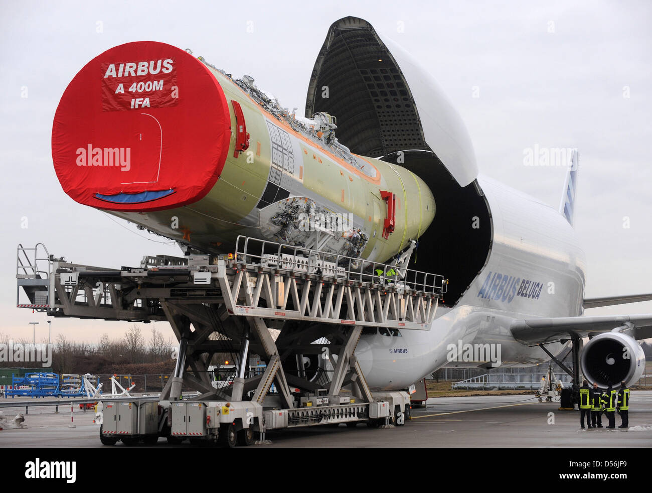 Several hundreds of Airbus employees watch as the fourth body section ...