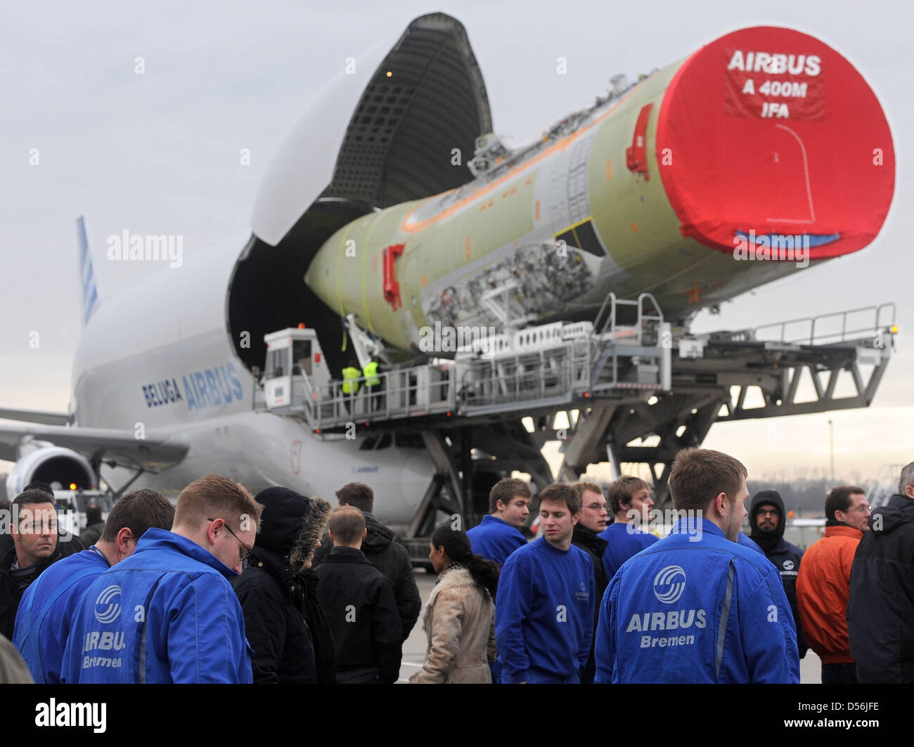 Several hundreds of Airbus employees watch as the fourth body section ...