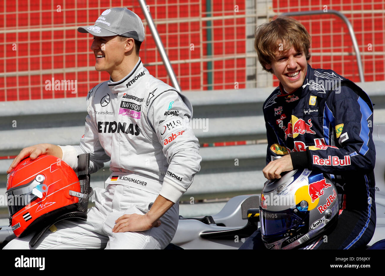 German Formula One driver Michael Schumacher of Mercedes GP (L) and ...