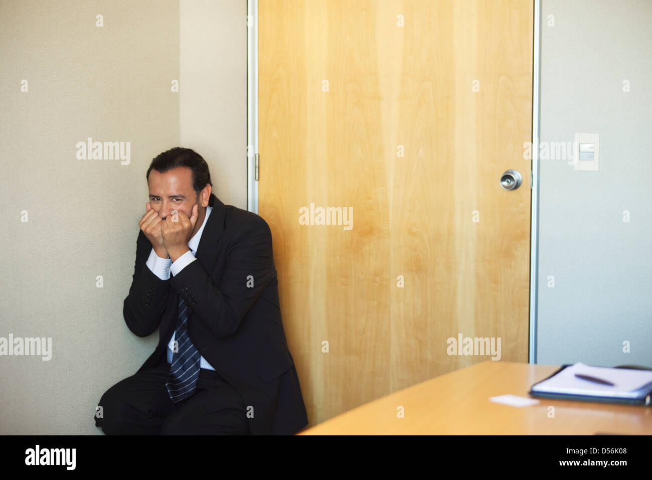 Man crouching scared hi-res stock photography and images - Alamy
