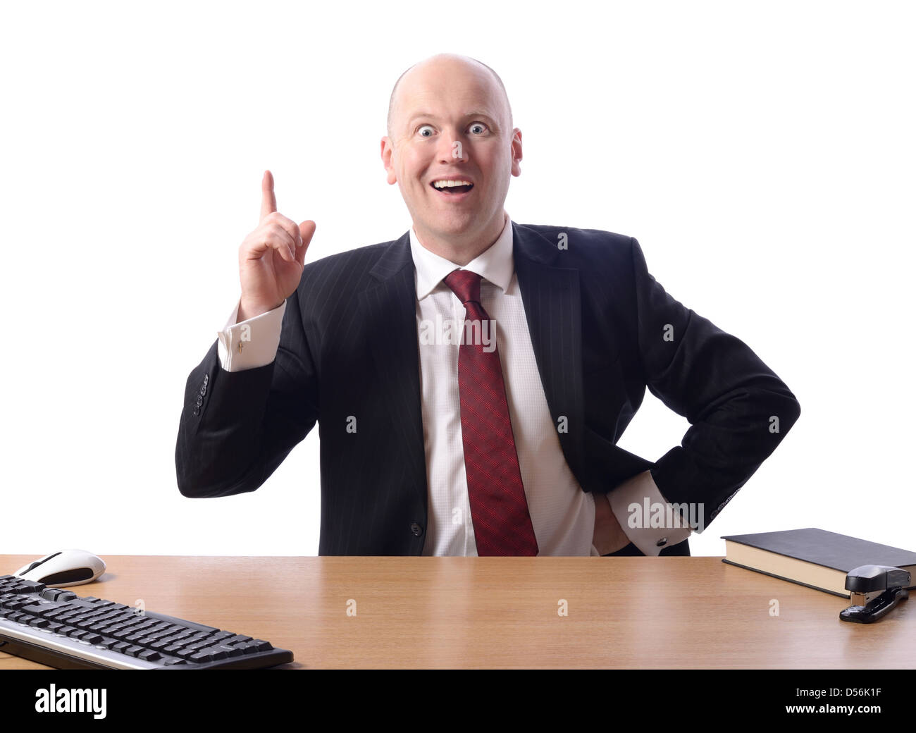 businessman sat at desk with a great idea or plan, isolated on white ...