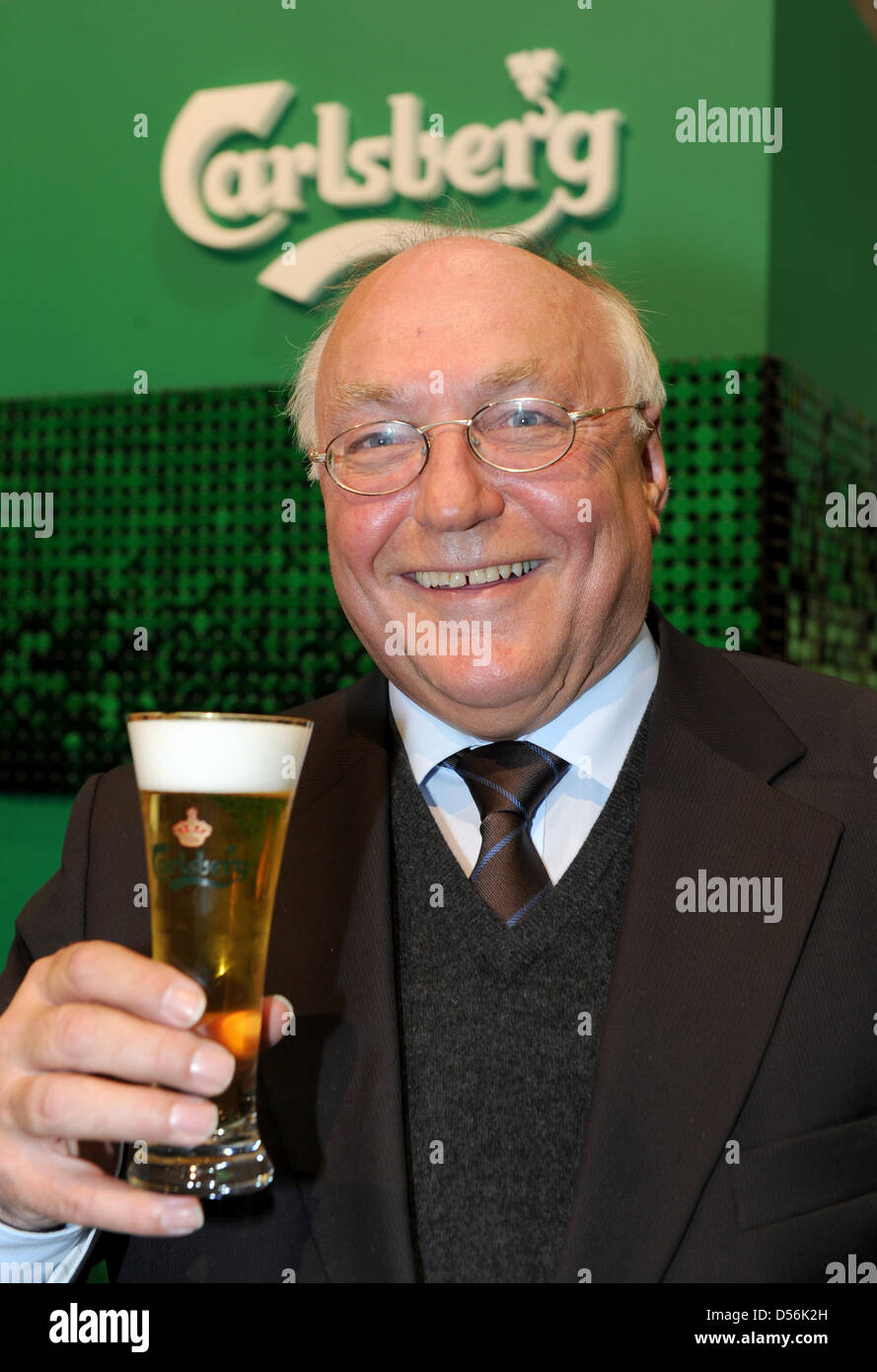 Carlsberg Germany CEO Wolfgang Burgard has a beer of his group after ...
