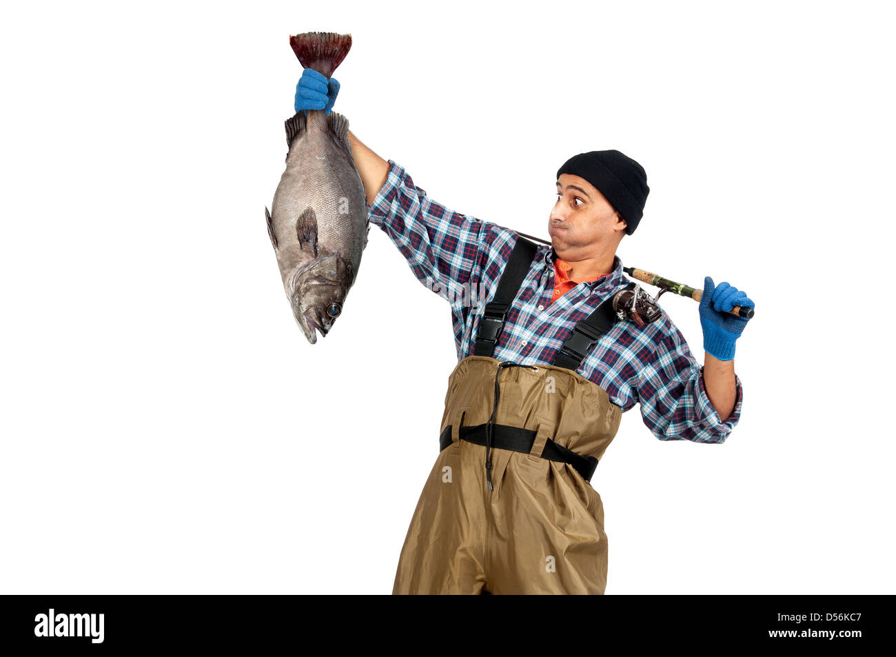 Fisherman posing with the catch isolated in white Stock Photo - Alamy