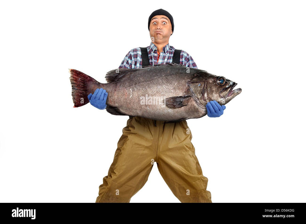 Fisherman posing with the catch isolated in white Stock Photo - Alamy