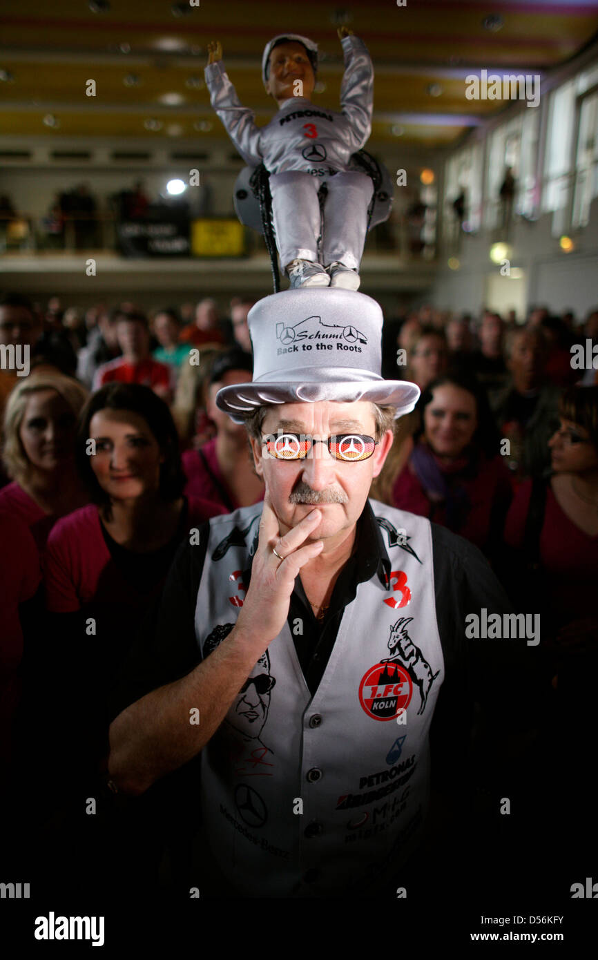 Formula One fan Reiner Ferling (C) and other follow the Grand Prix of ...