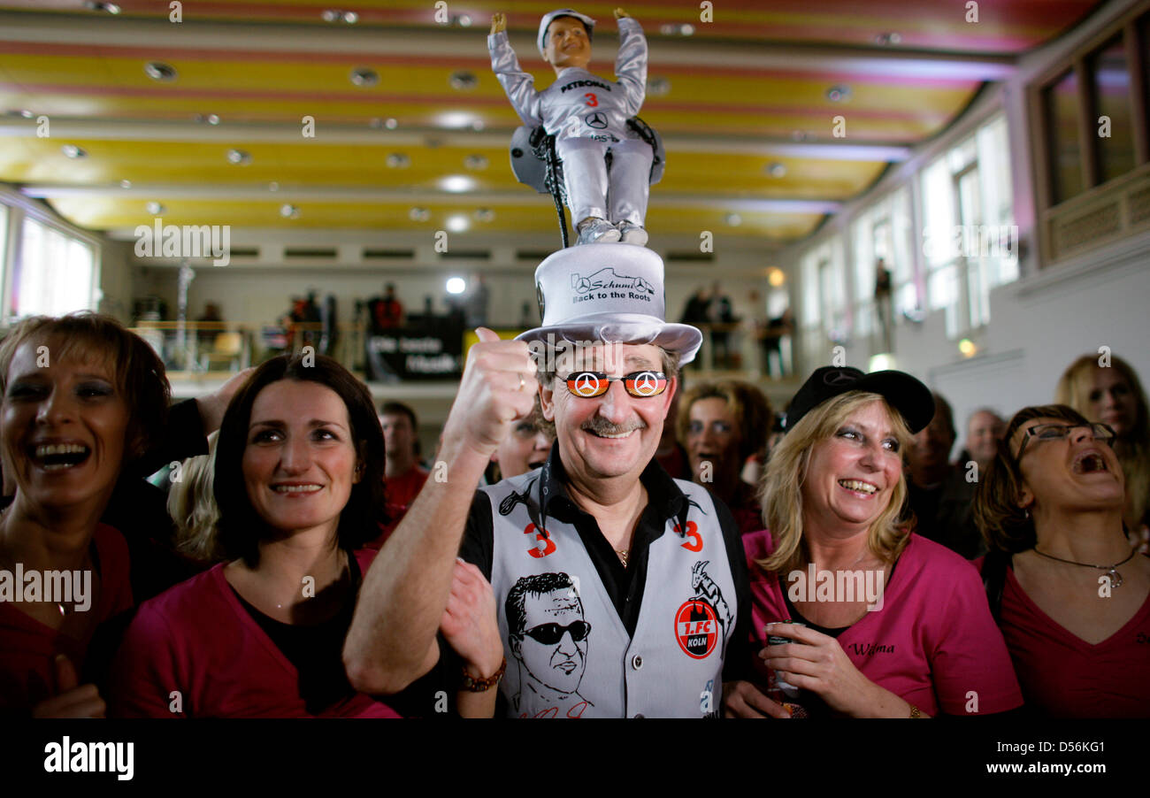 Formula One fan Reiner Ferling (C) and other follow the Grand Prix of ...
