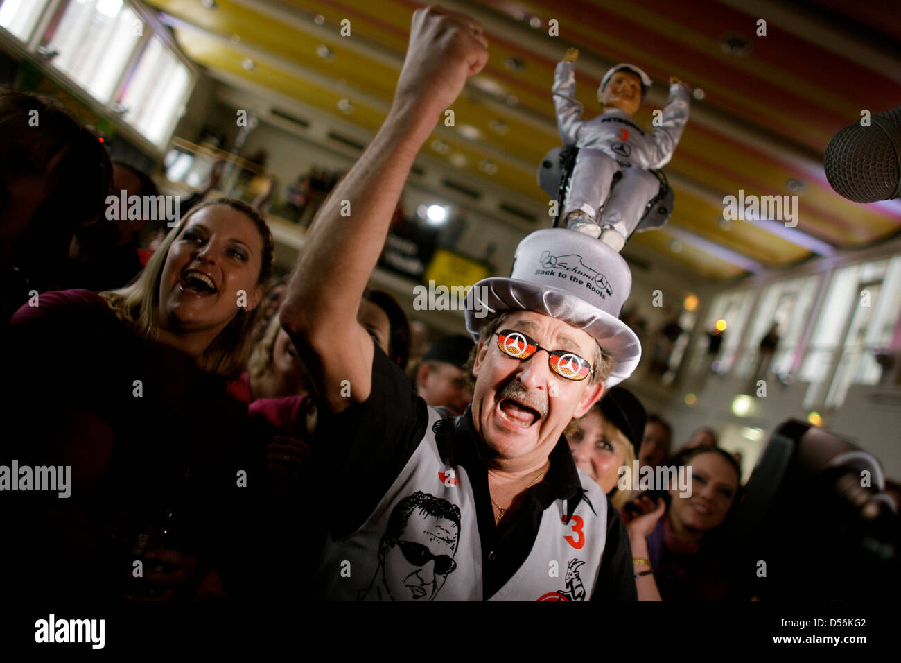 Formula One fan Reiner Ferling (C) and other follow the Grand Prix of ...