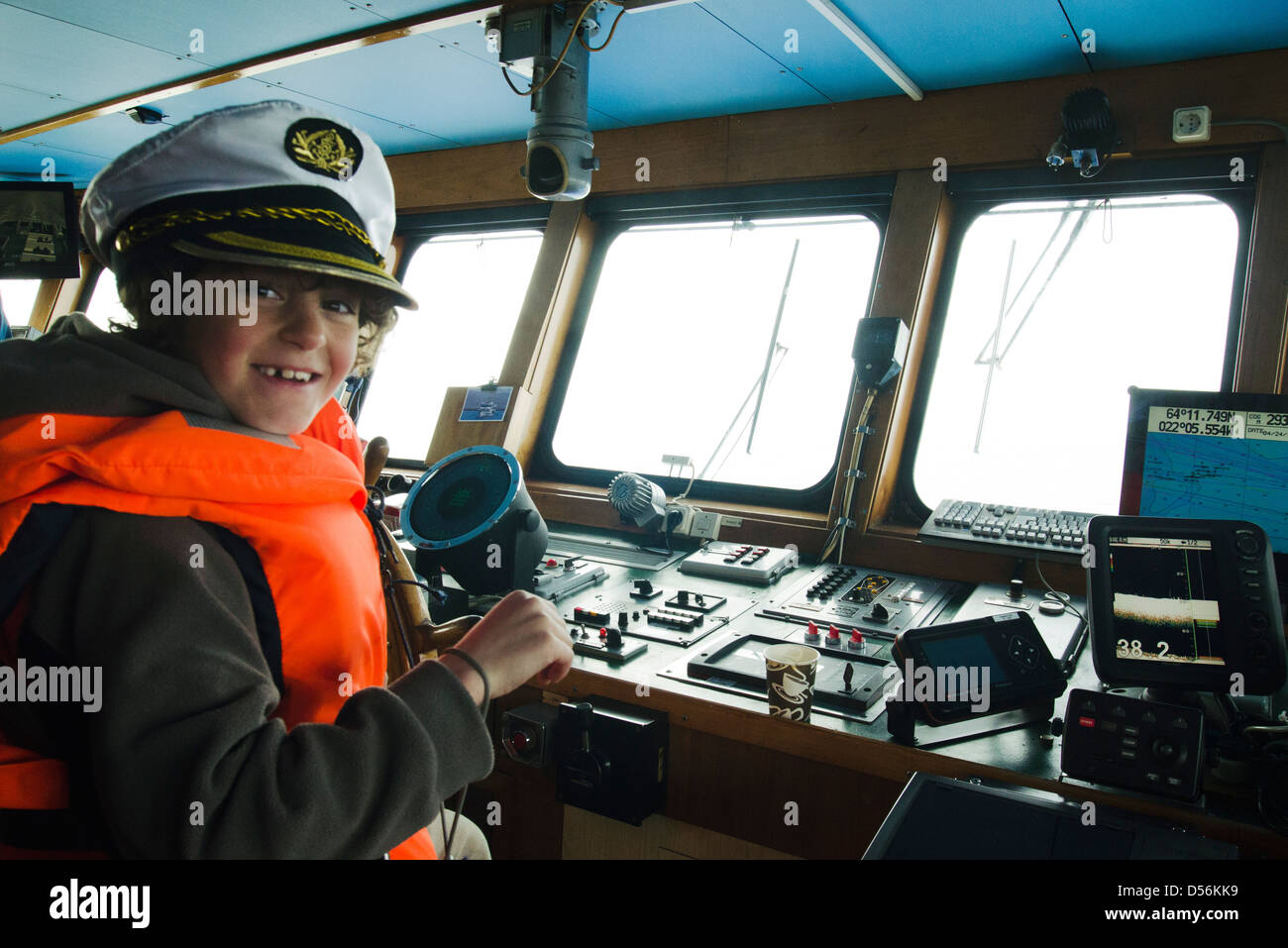 Boy playing captain, cockpit Stock Photo - Alamy