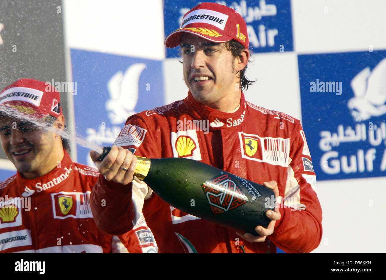 Spanish Fernando Alonso (R) of Ferrari celebrates his victory next to ...