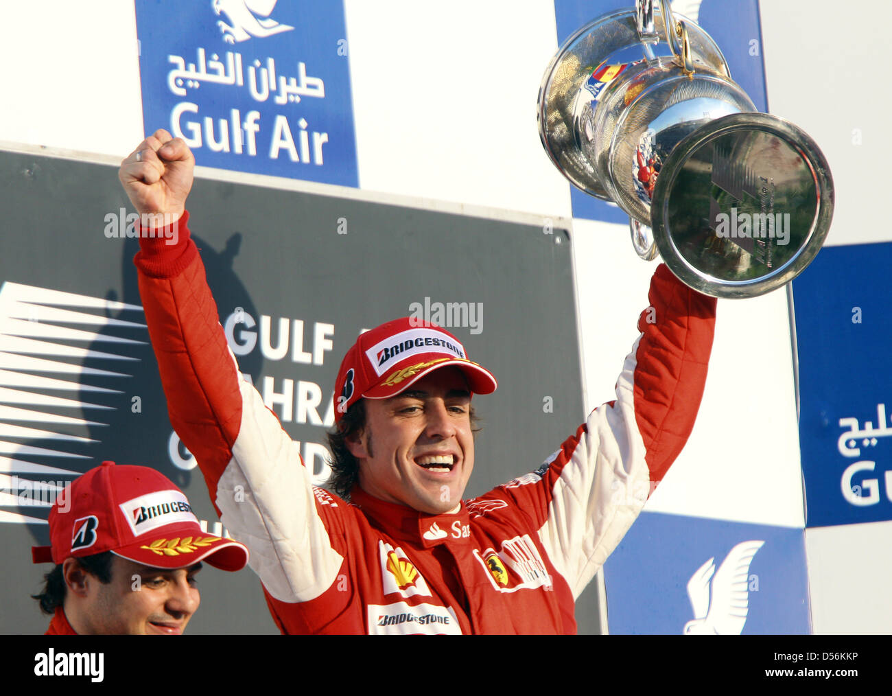 Spanish Fernando Alonso (R) of Ferrari celebrates his victory next to ...