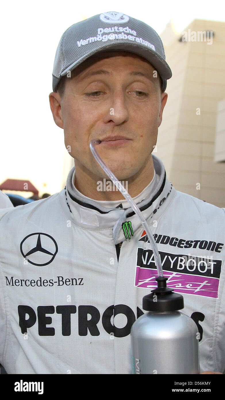 German Michael Schumacher of Mercedes Grand Prix drinks from a bottle ...