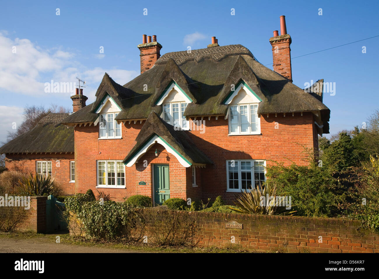 Red brick thatched building formerly the Chequers village pub ...