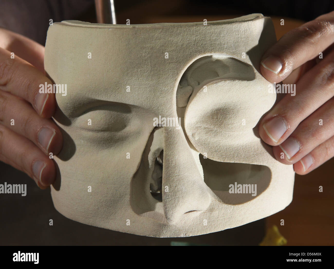 A medical engineer presents computer-generated models of human skulls ...