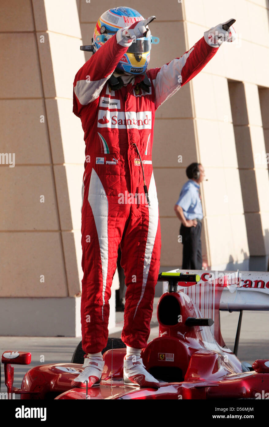 Spanish Fernando Alonso of Ferrari celebrates his victory in the finish ...