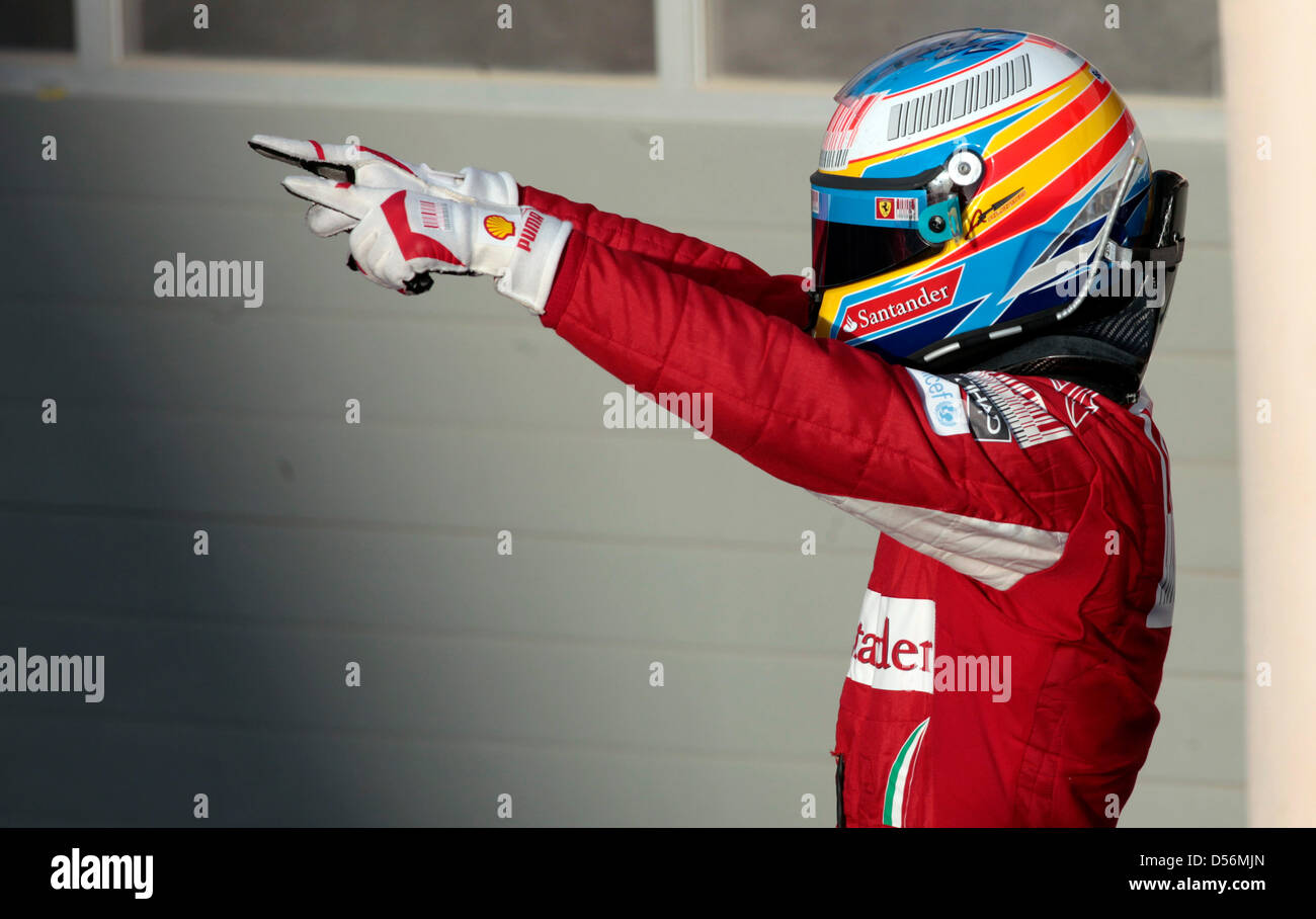 Spanish Fernando Alonso of Ferrari celebrates his victory in the finish ...