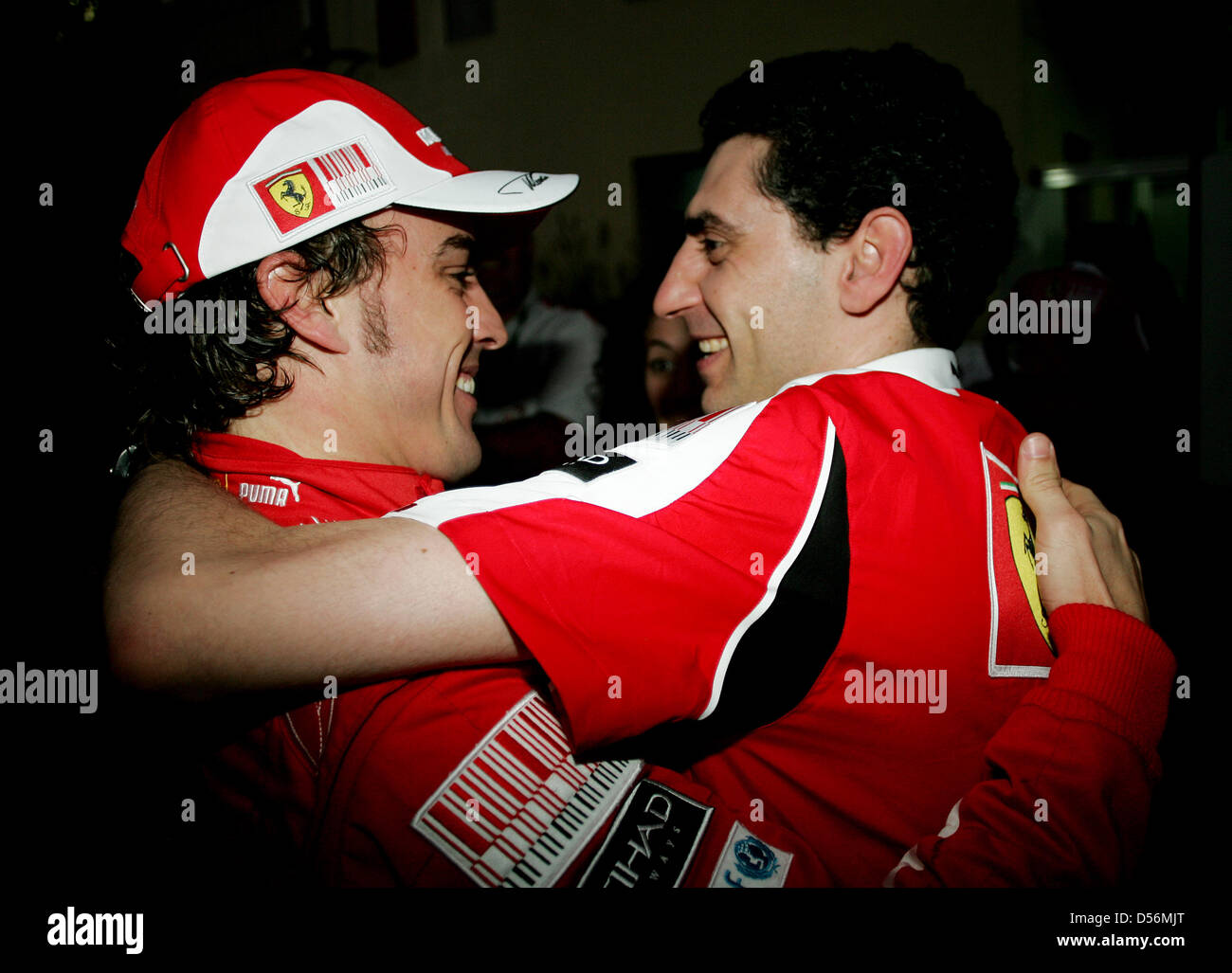 Spanish Fernando Alonso (L) of Ferrari celebrates his victory with a ...