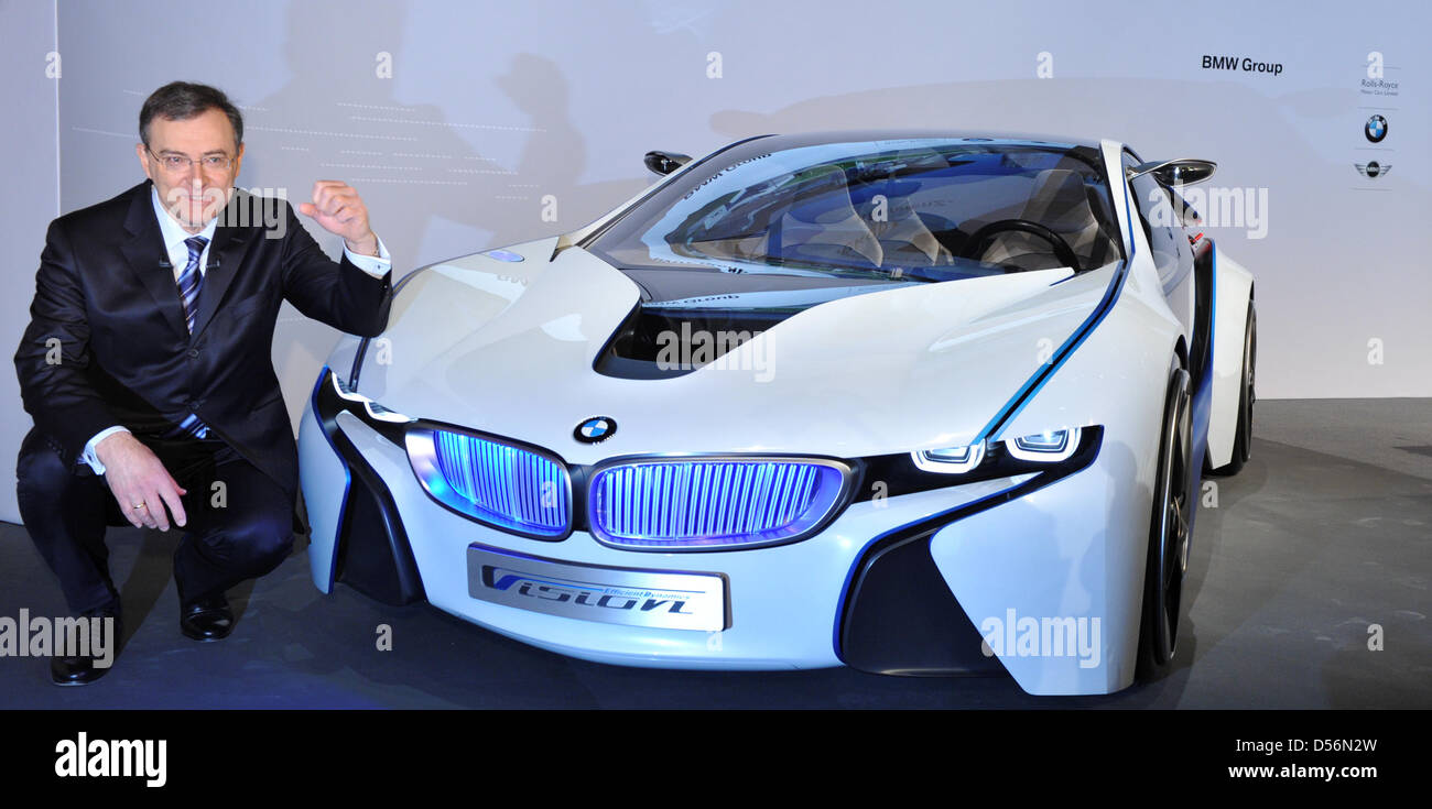 Norbert Reithofer, CEO Of BMW Group, poses next to a concept car at a ...