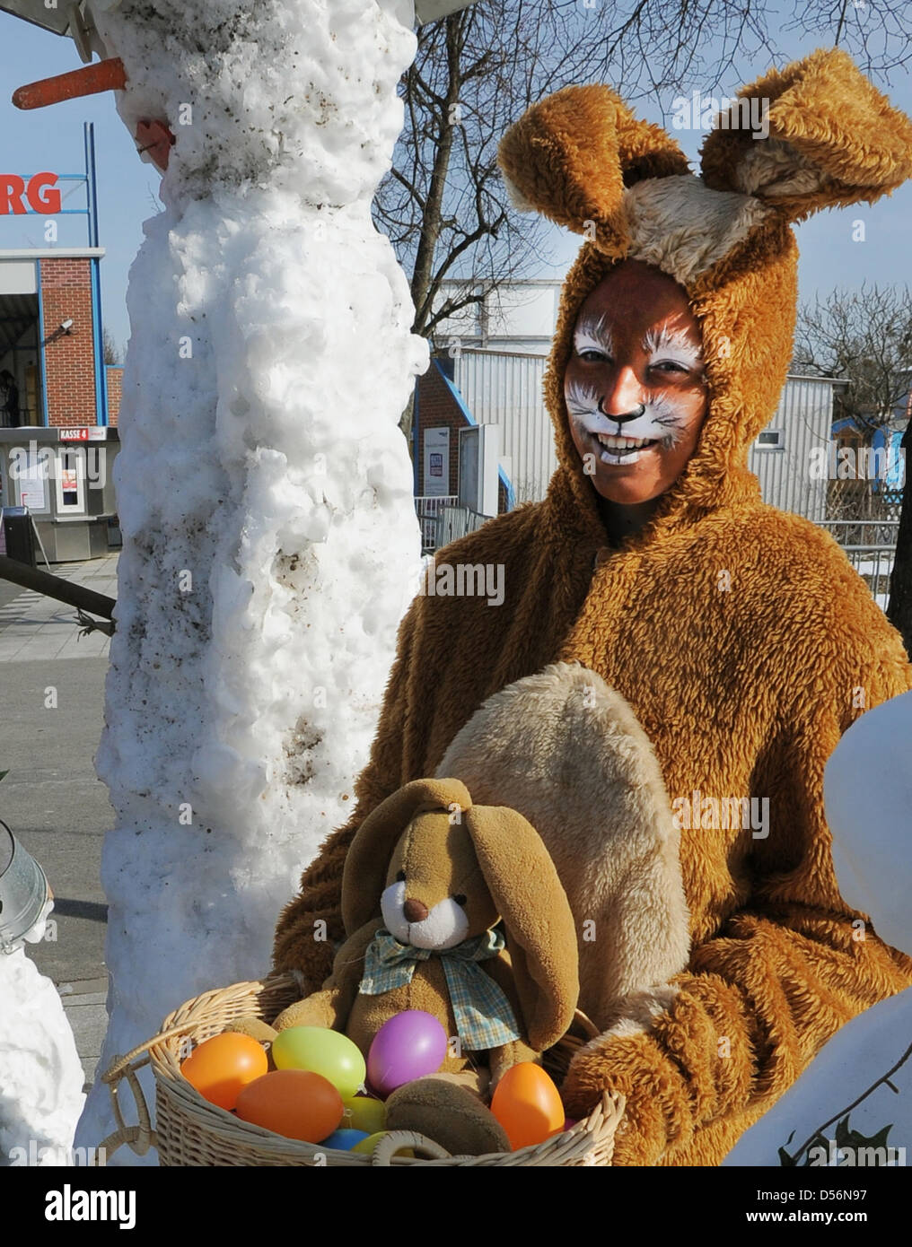 A person costumed as Easter Bunny poses for the camera at the ...