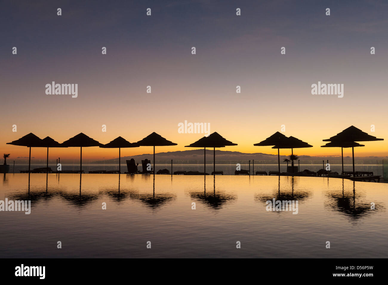 Looking across infinity pool at dusk, Hotel Barcelo Santiago, Tenerife ...
