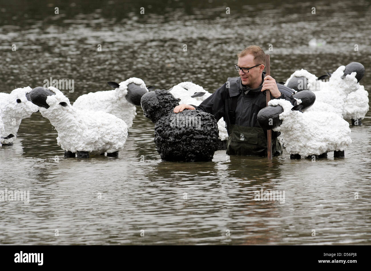 Sculptor Jens-Uwe Scholz poses with 30 so-called 'pond sheep' in Masch ...