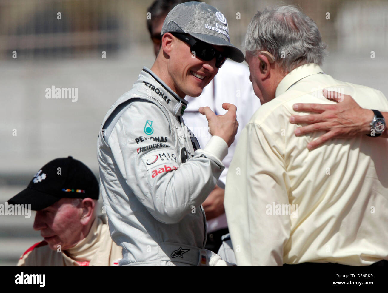 German Michael Schumacher (L) of Mercedes Grand Prix speaks with former ...