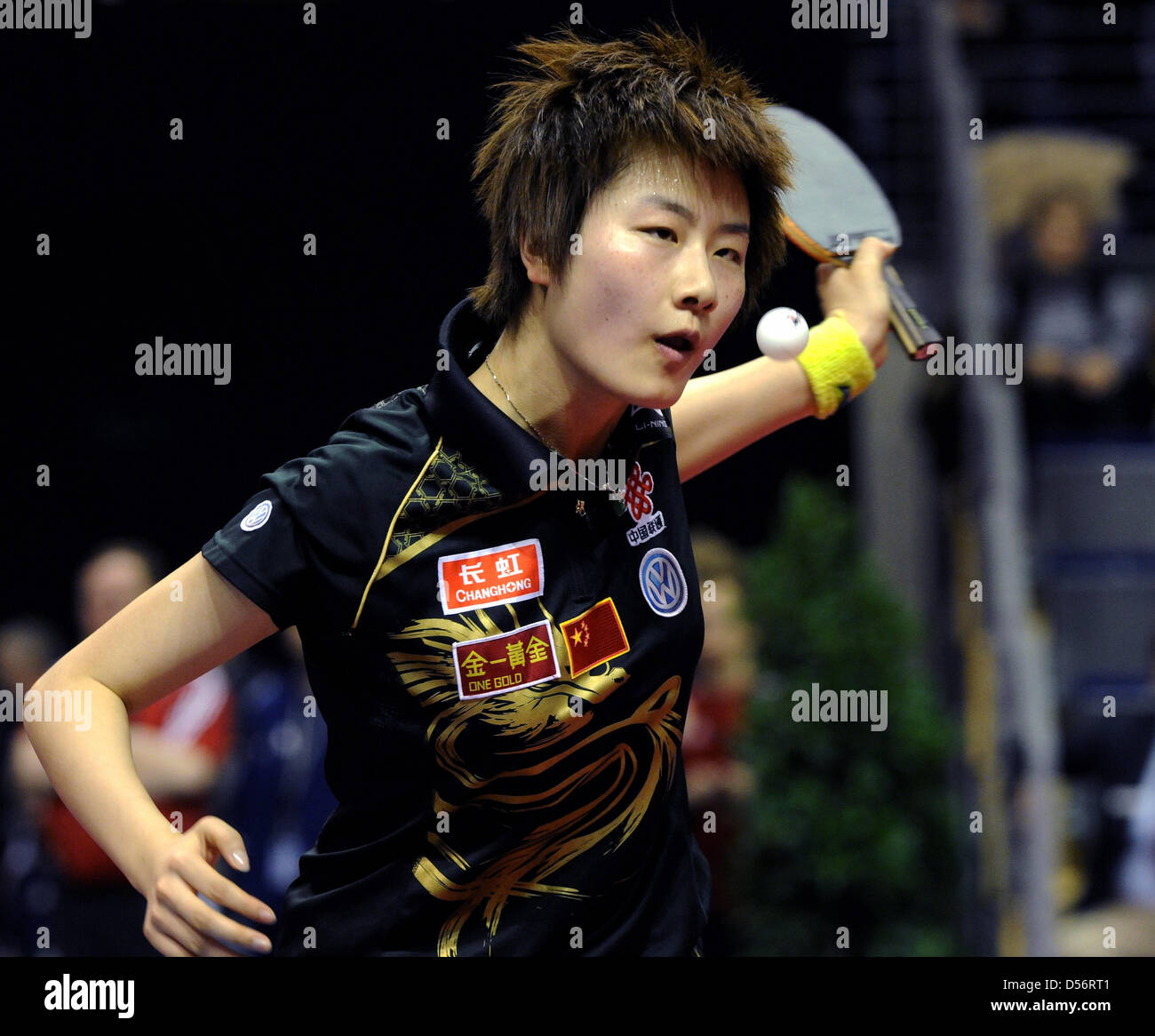 Chinese Ding Ning serves a ball during the Women's Doubles final at the ...