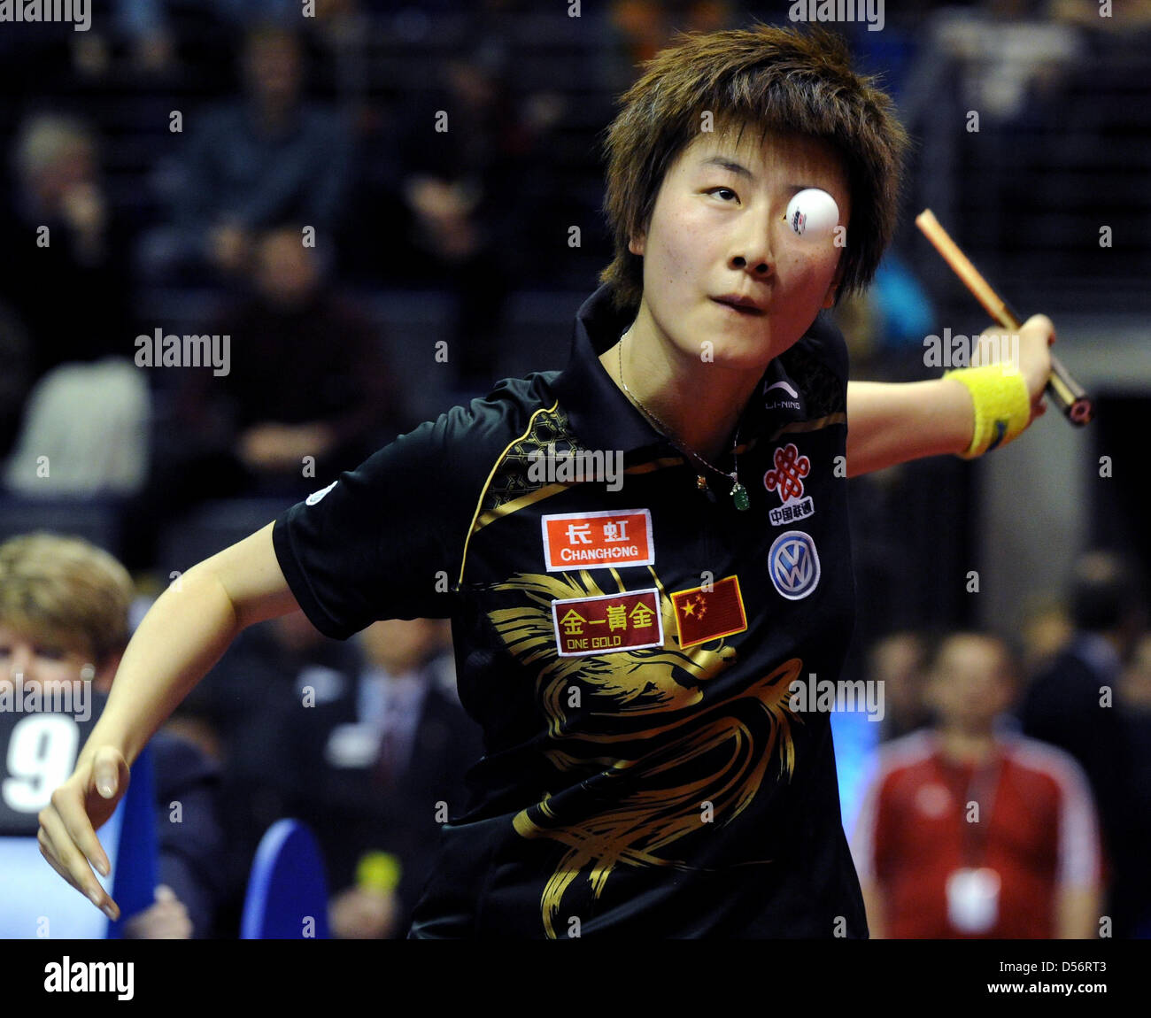 Chinese Ding Ning serves a ball during the Women's Doubles final at the ...