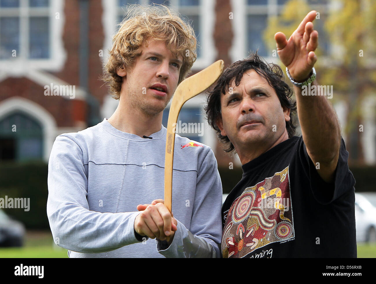 Aborigine Ron Murray (R) explains German Formula One driver Seabstian ...