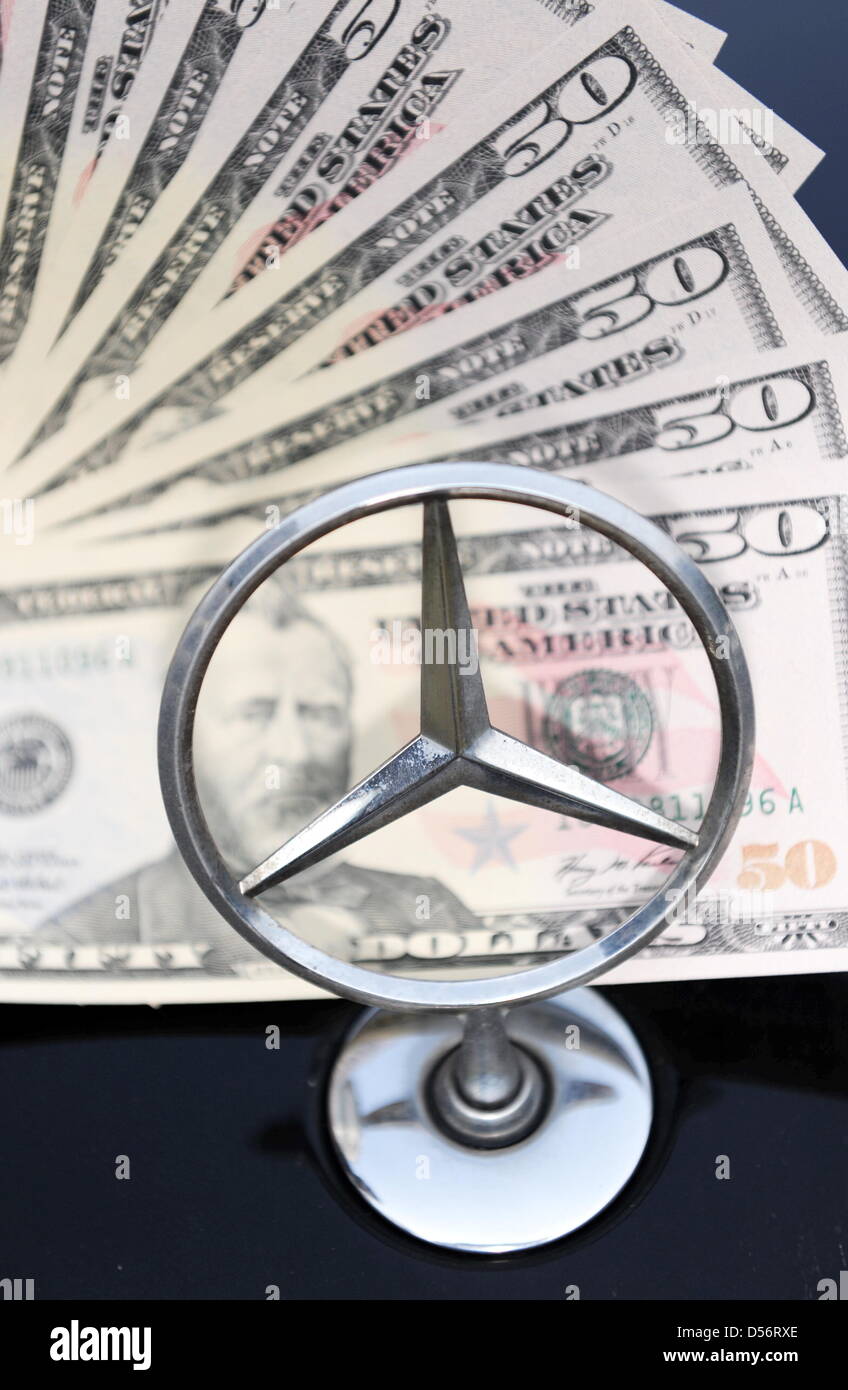 ILLUSTRATION - Dollar bills are pictured behind a Mercedes star in ...
