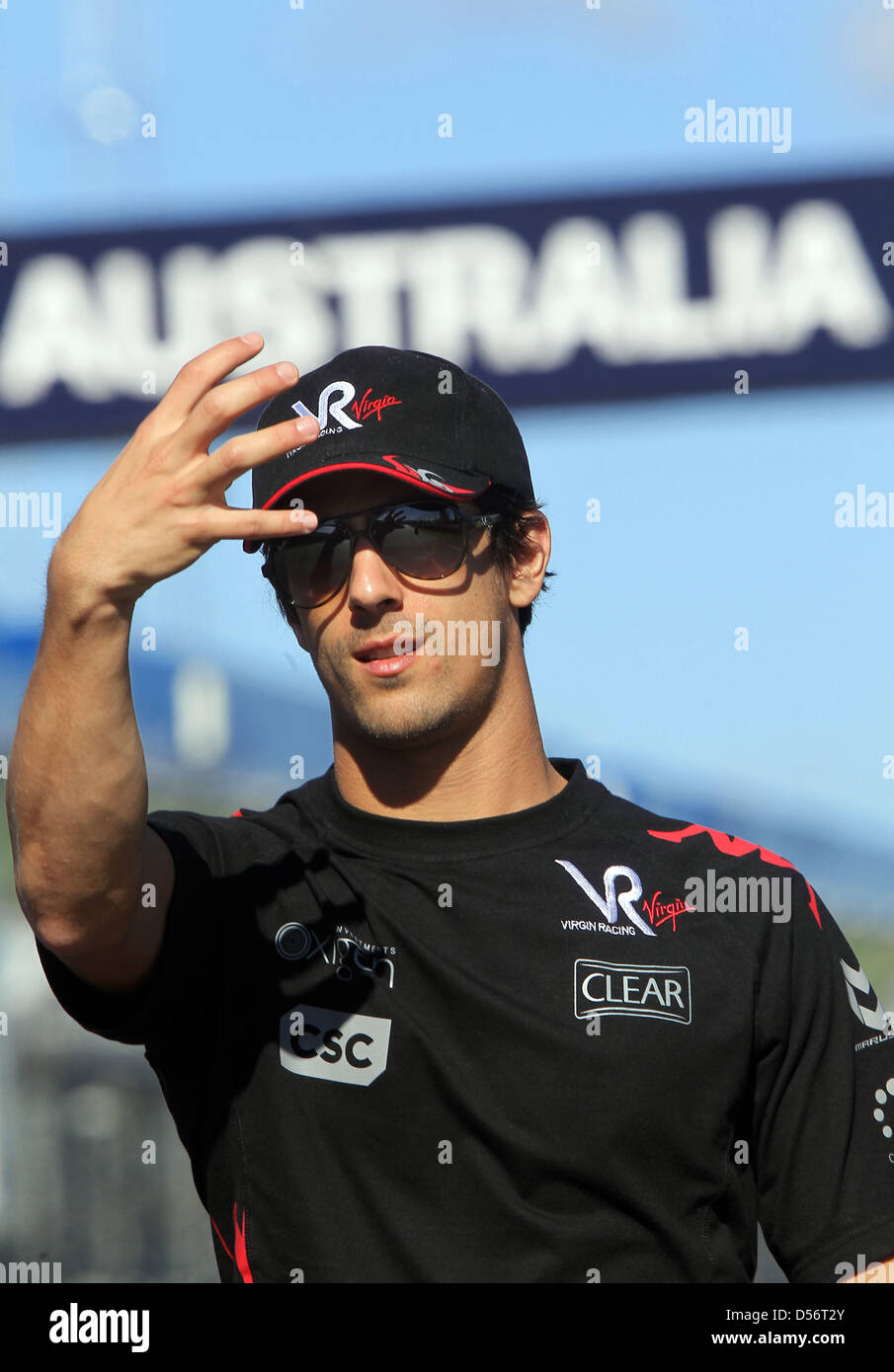 Brazilian Lucas di Grassi of Team Virgin Racing gestures in the paddock ...