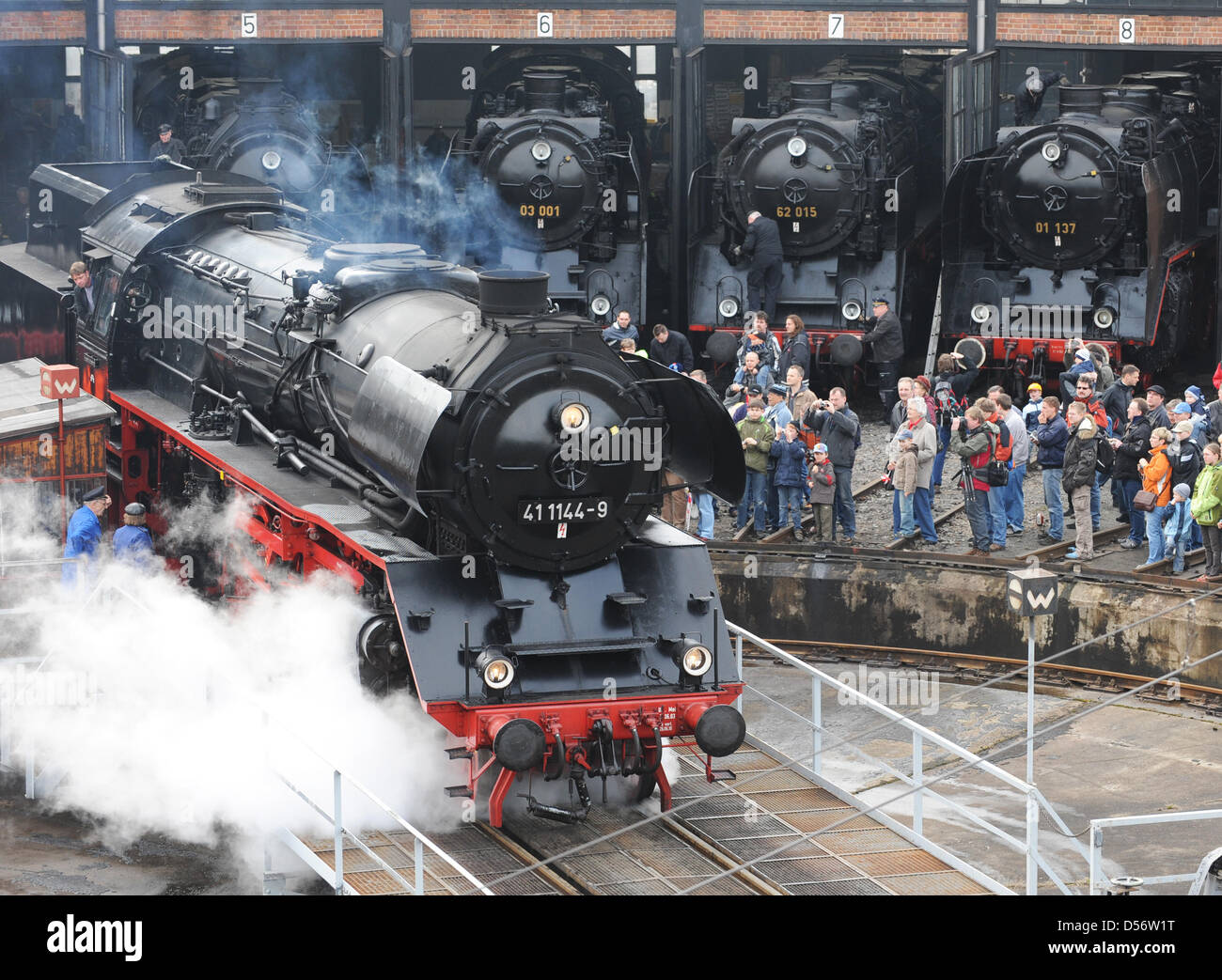 A locomotive type 41 wheezes steam on a locomotive turntable at the ...