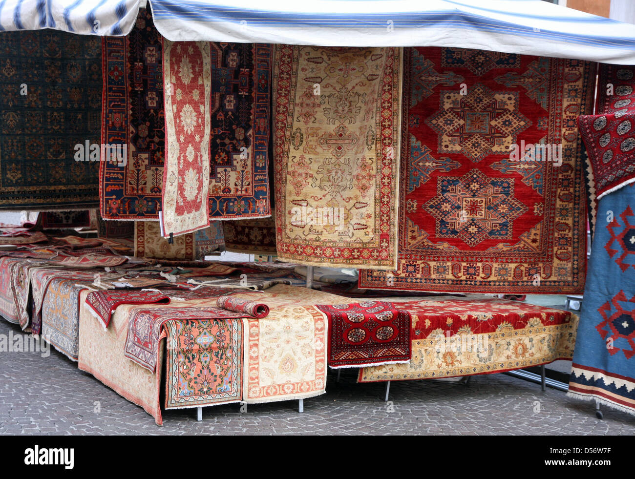 street stall with resale of ancient Persian carpets Stock Photo - Alamy