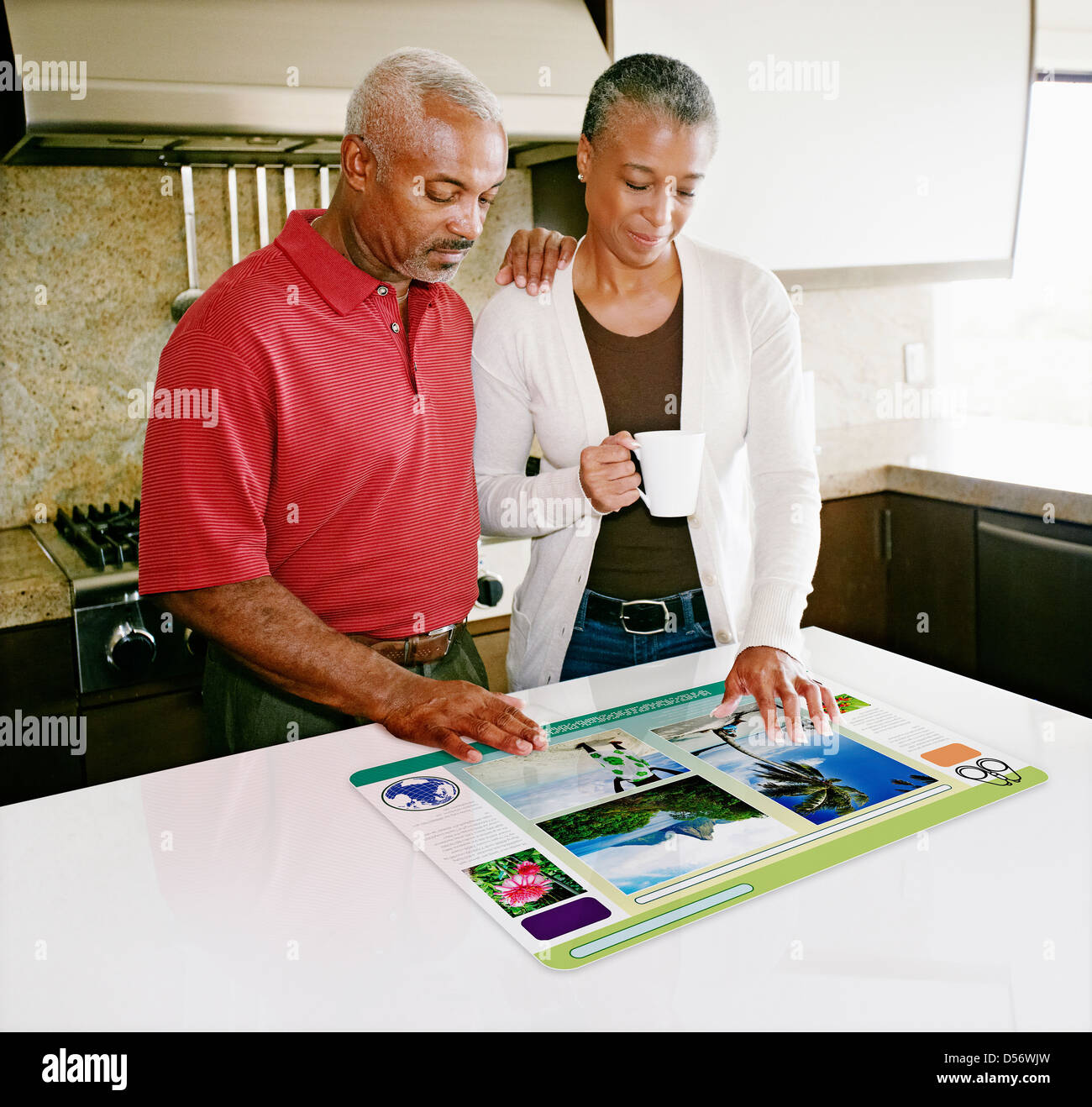 Couple using computer in table Stock Photo - Alamy