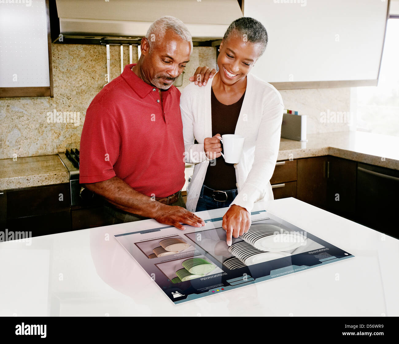 Couple using computer in table Stock Photo - Alamy