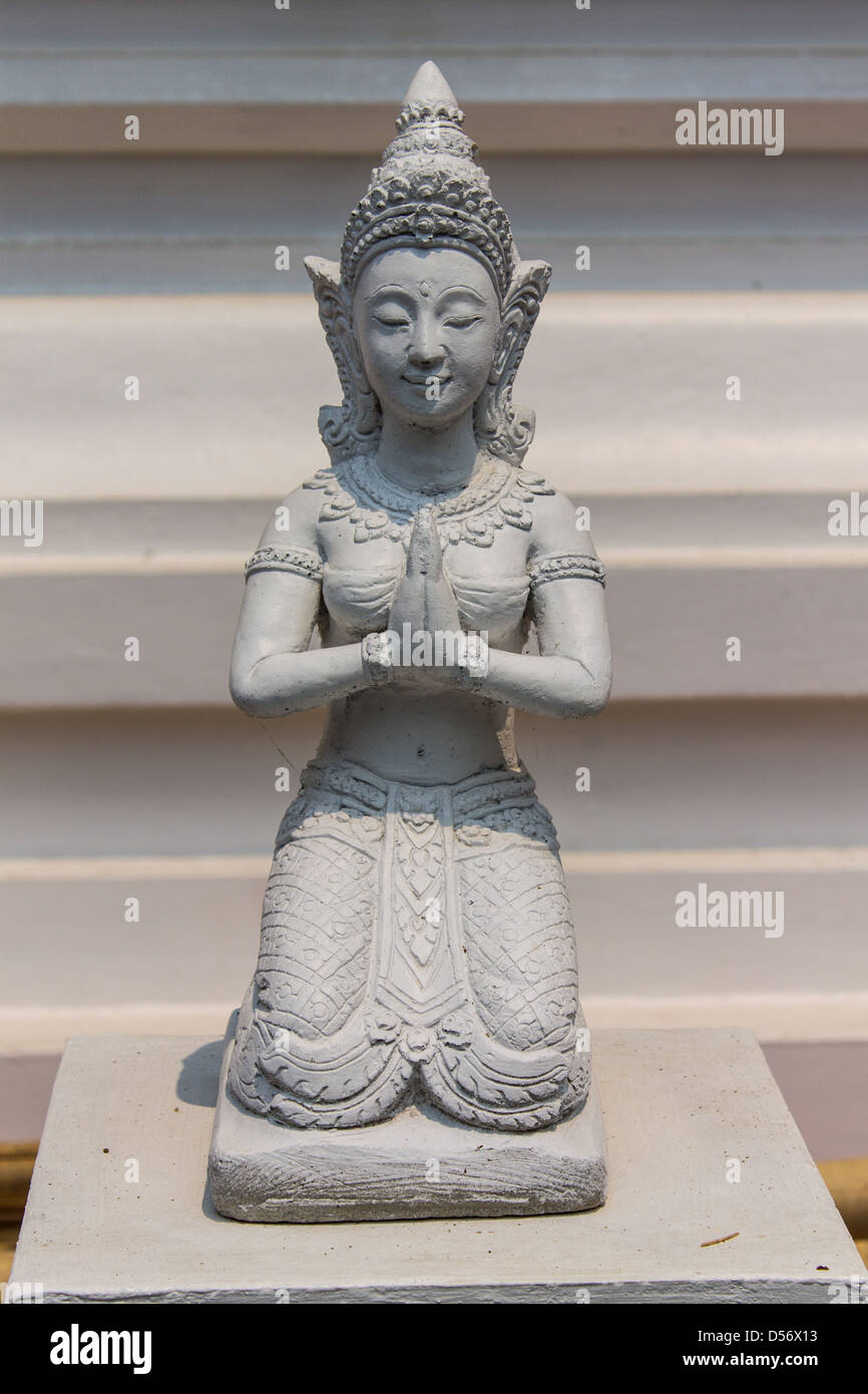 Sitting woman deva statue Stock Photo - Alamy