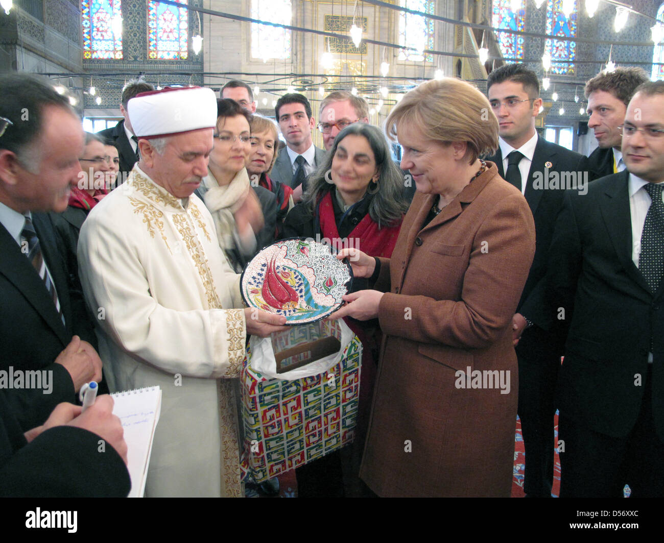 German Chancellor Angela Merkel (C) visits Sultan Ahmed Mosque and ...