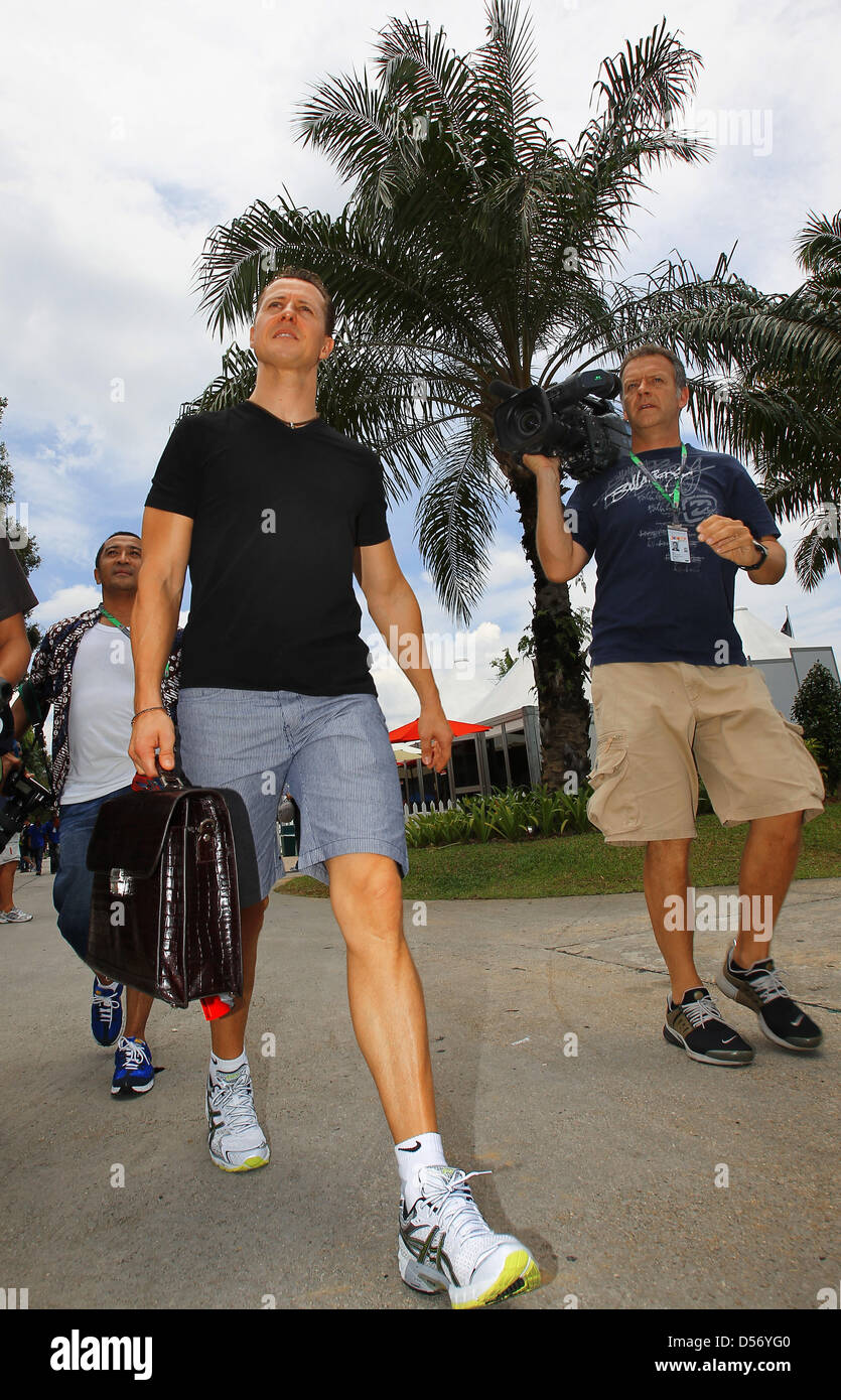 German Michael Schumacher (front) of Mercedes Grand Prix signs arrives ...