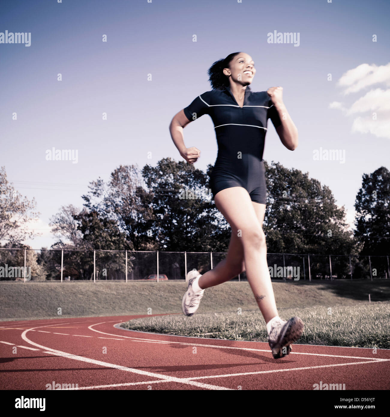 African American woman running on track Stock Photo - Alamy