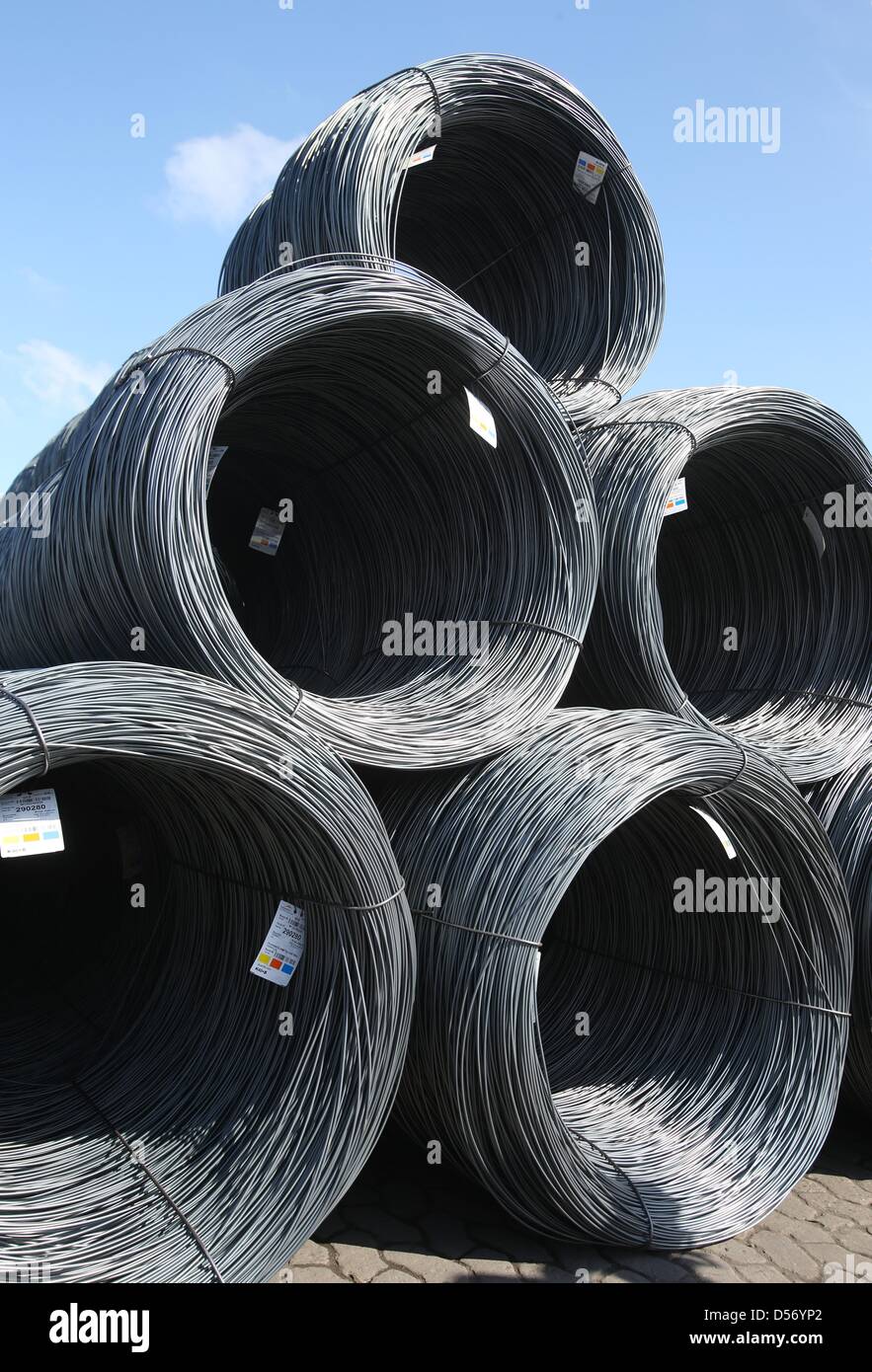 Steel coils are stored at the outdoor premises of the ArcelorMittal ...