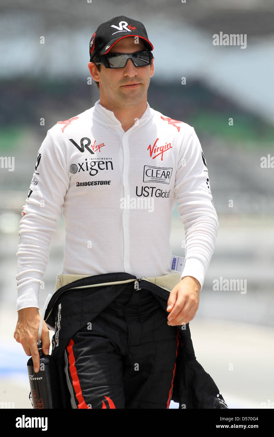 Germany's Formula One driver Timo Glock of Team Virgin Racing walks ...