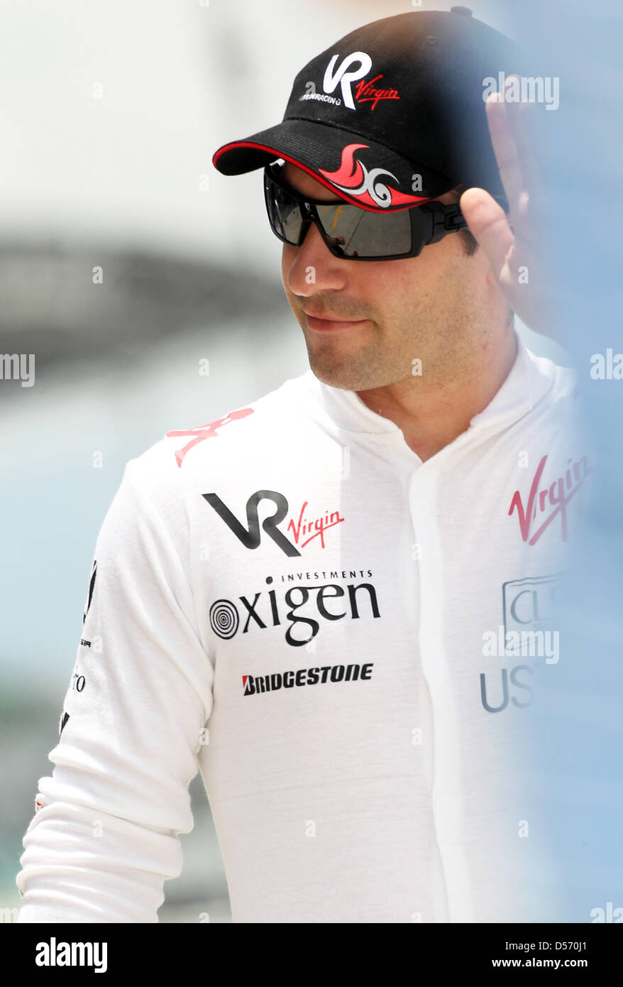 Germany's Formula One driver Timo Glock of Team Virgin Racing walks ...