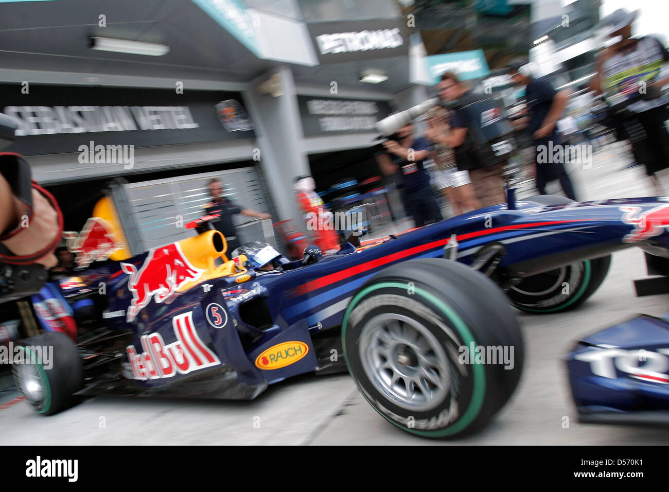 Germany's Formula One driver Sebastian Vettel of Team Red Bull steers ...
